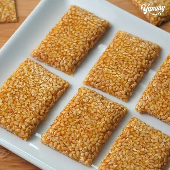 Orange-yellow CRUNCHY SESAME SEED CANDY Flavored with Saffron Crunchy ...