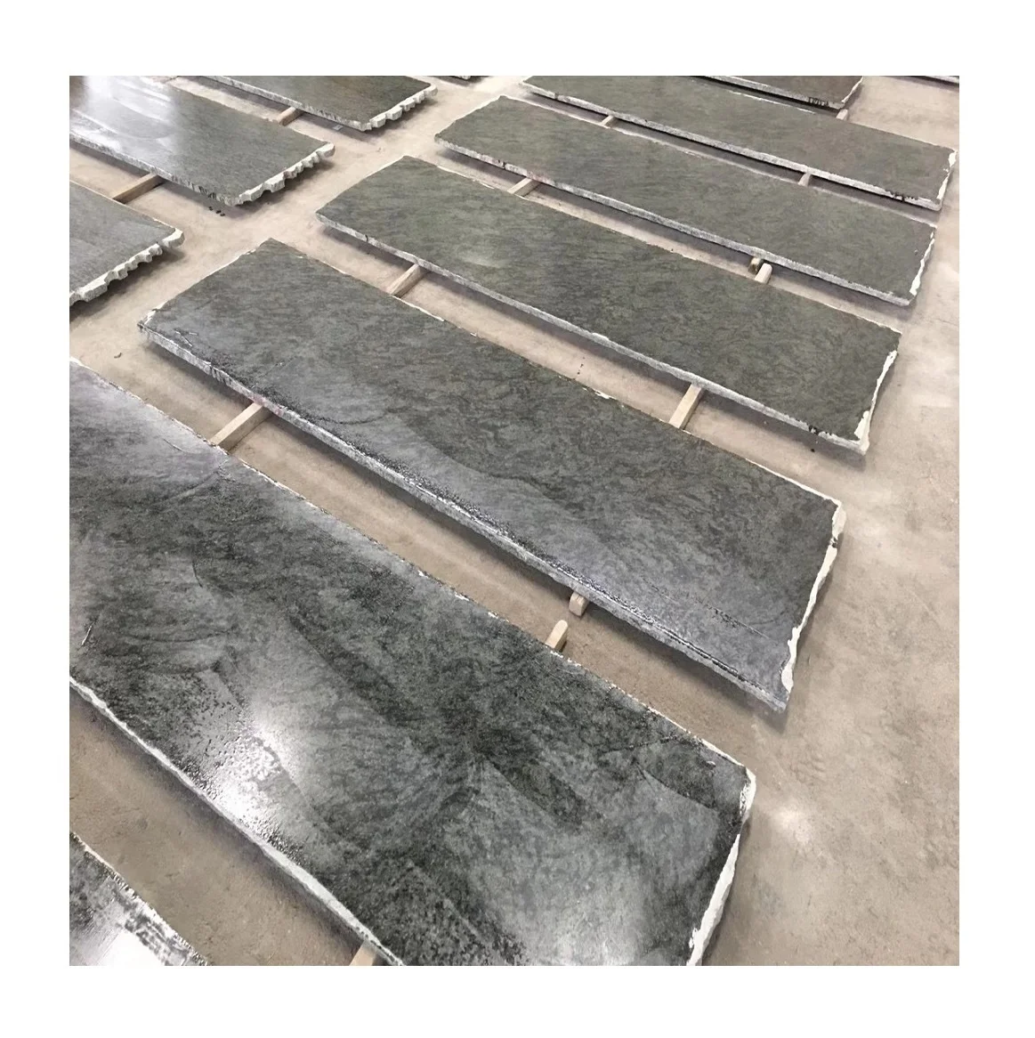 Olive green granite natural polished slabs with uncut rough edges ...