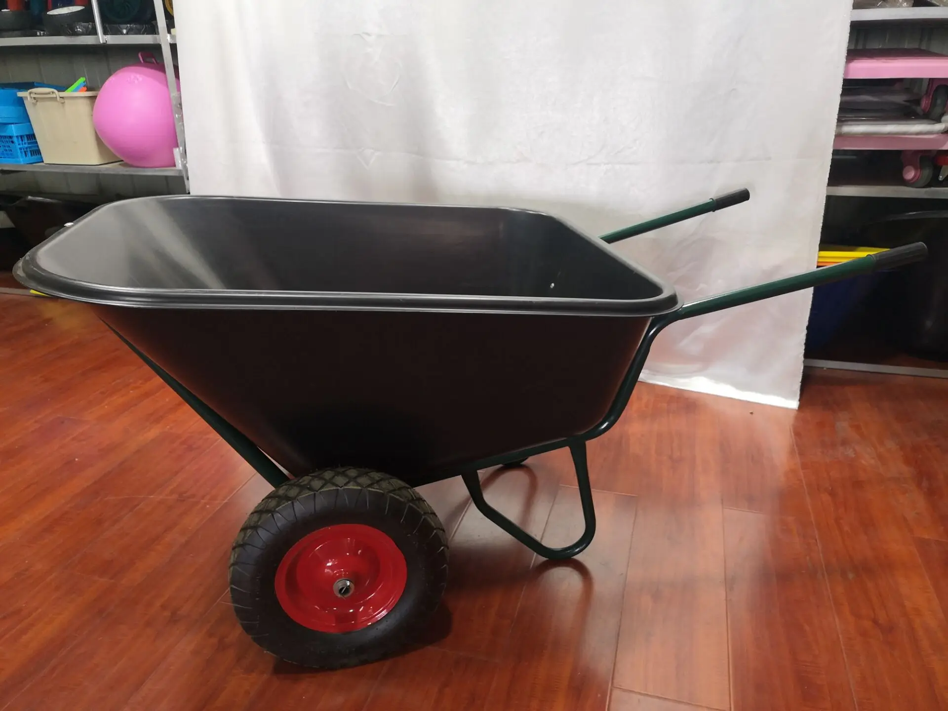 Black Plastic Tray Orange Frame Two Wheel Wheelbarrow