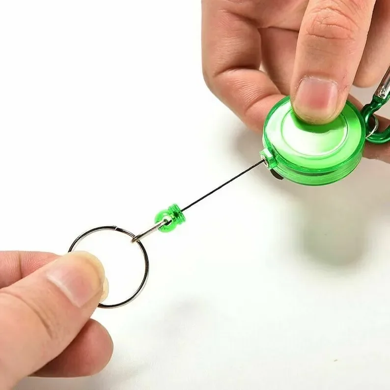 Retractable Steel Cord Pull Reel Keychains - Fashion & Utility