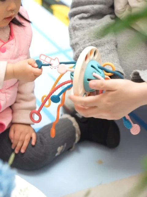 Infant Sensory Double Egg Yolk Pull Push Toy Teething Toys Hand Finger ...