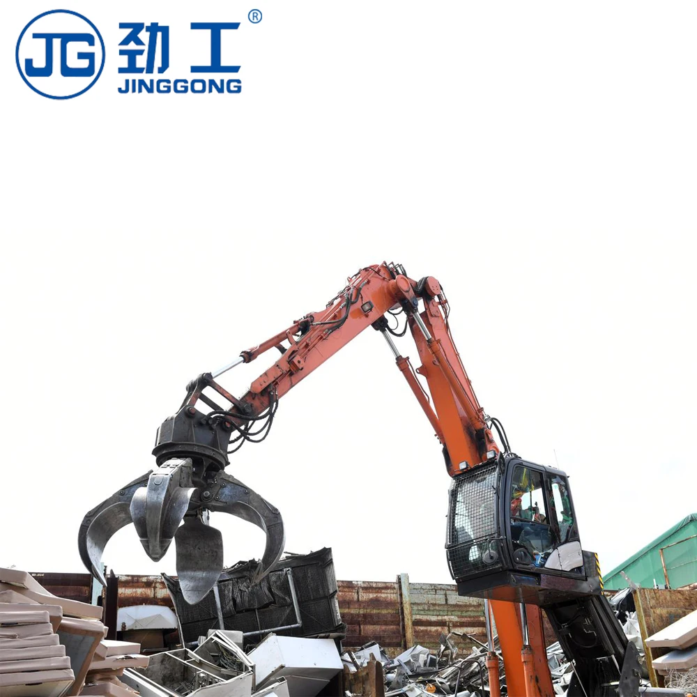 Material handlers and handling excavator scrap metal loader work at ...
