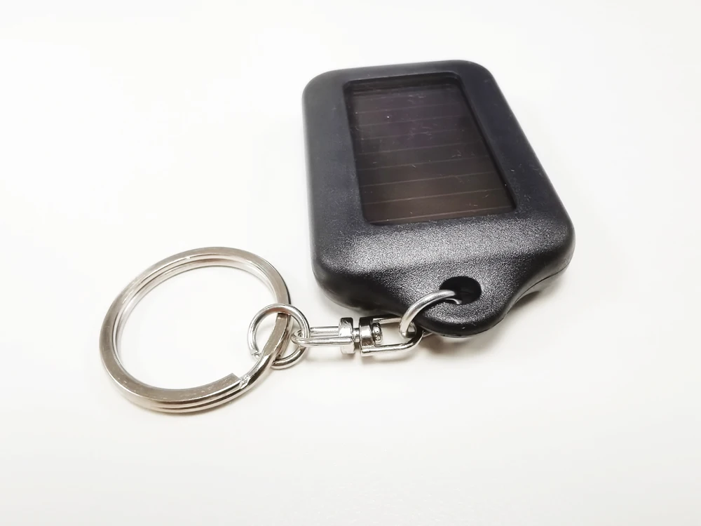 Solar Powered LED Flashlight Keychain - Portable & Durable