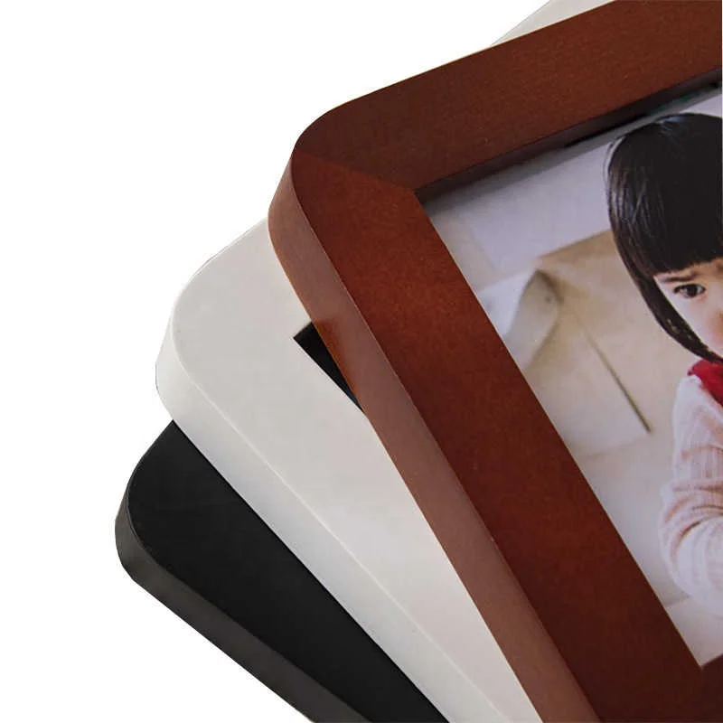 Rounded Solid Wood Photo Frame On The Table And Printing To Create A ...