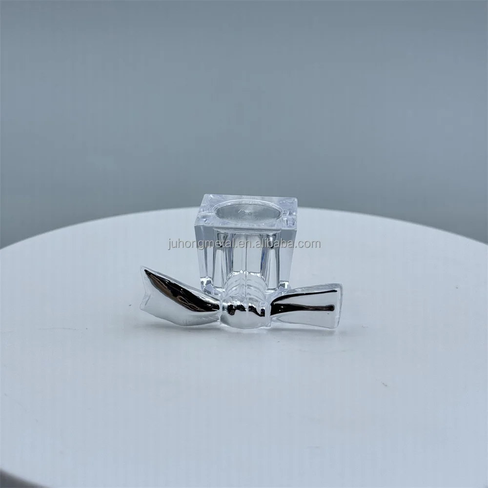 Close-up view of perfume cap showing electroplated finish