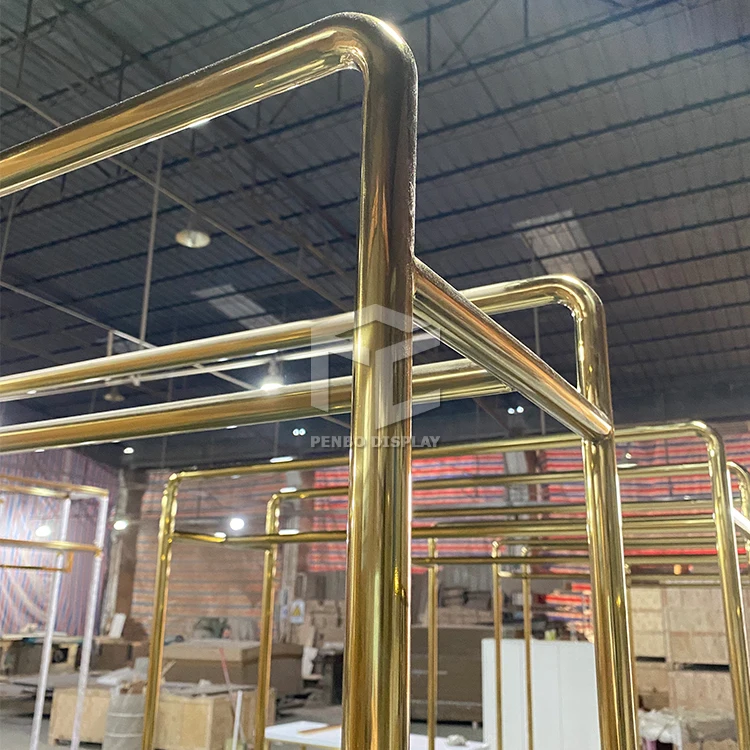 Elegant Rose Gold Display Racks - Perfect for Clothing Stores