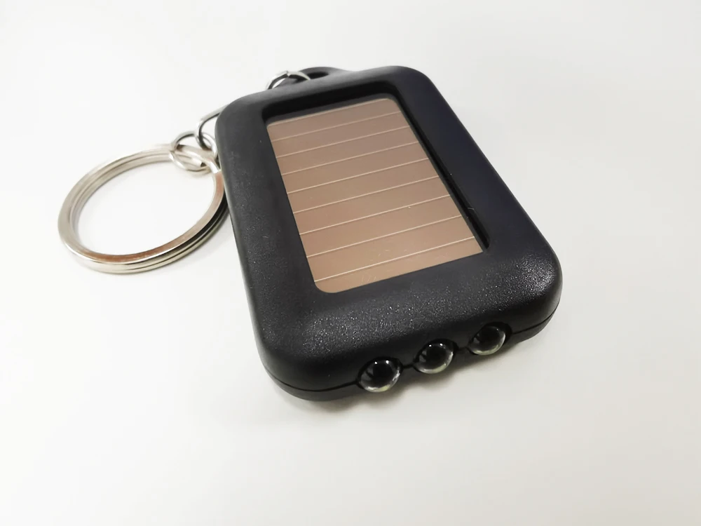 Solar Powered LED Flashlight Keychain - Portable & Durable