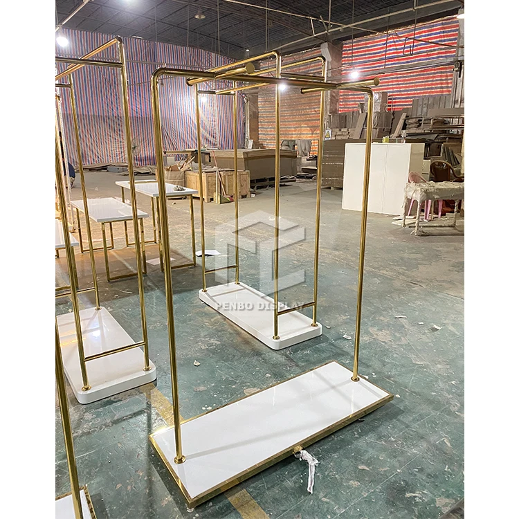 Elegant Rose Gold Display Racks - Perfect for Clothing Stores